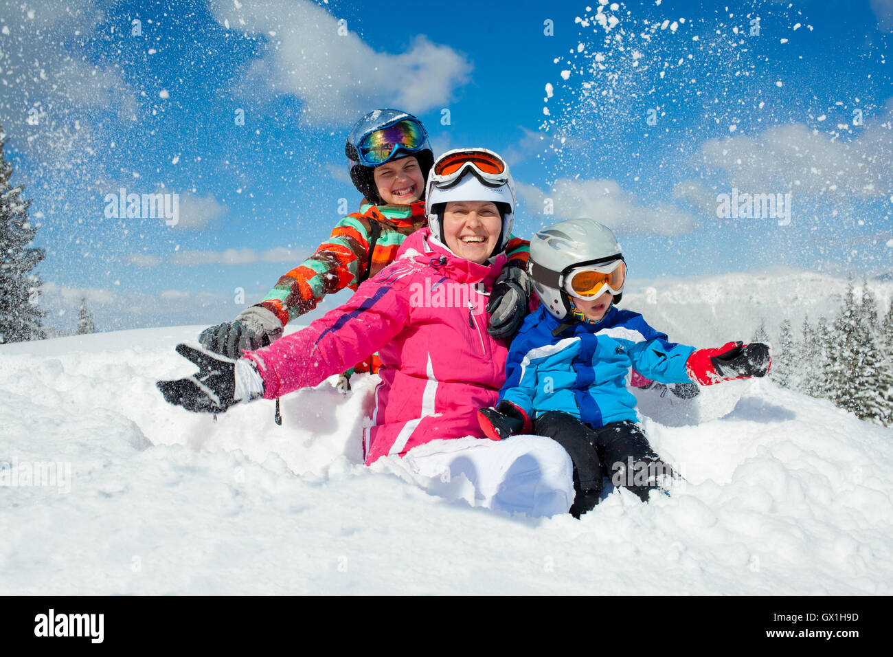 Playing in snow Stock Photo - Alamy