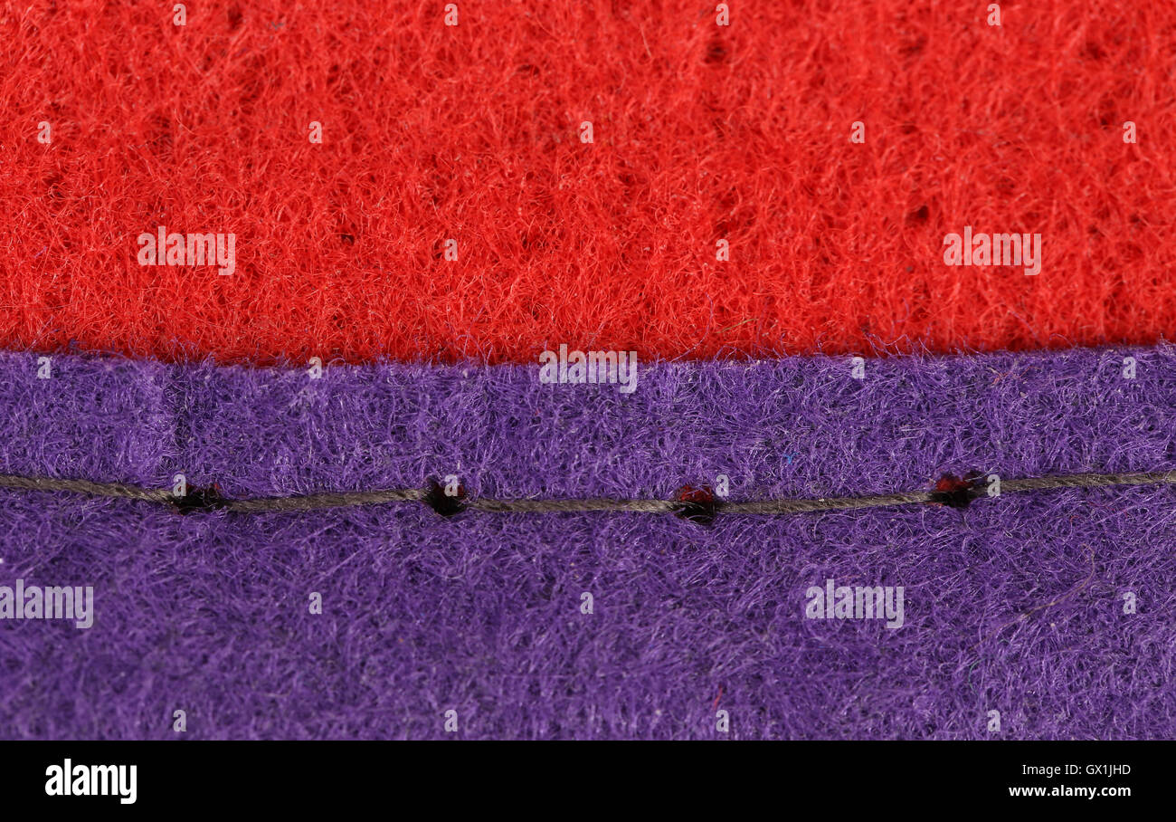 Join of red and blue fabric Stock Photo - Alamy