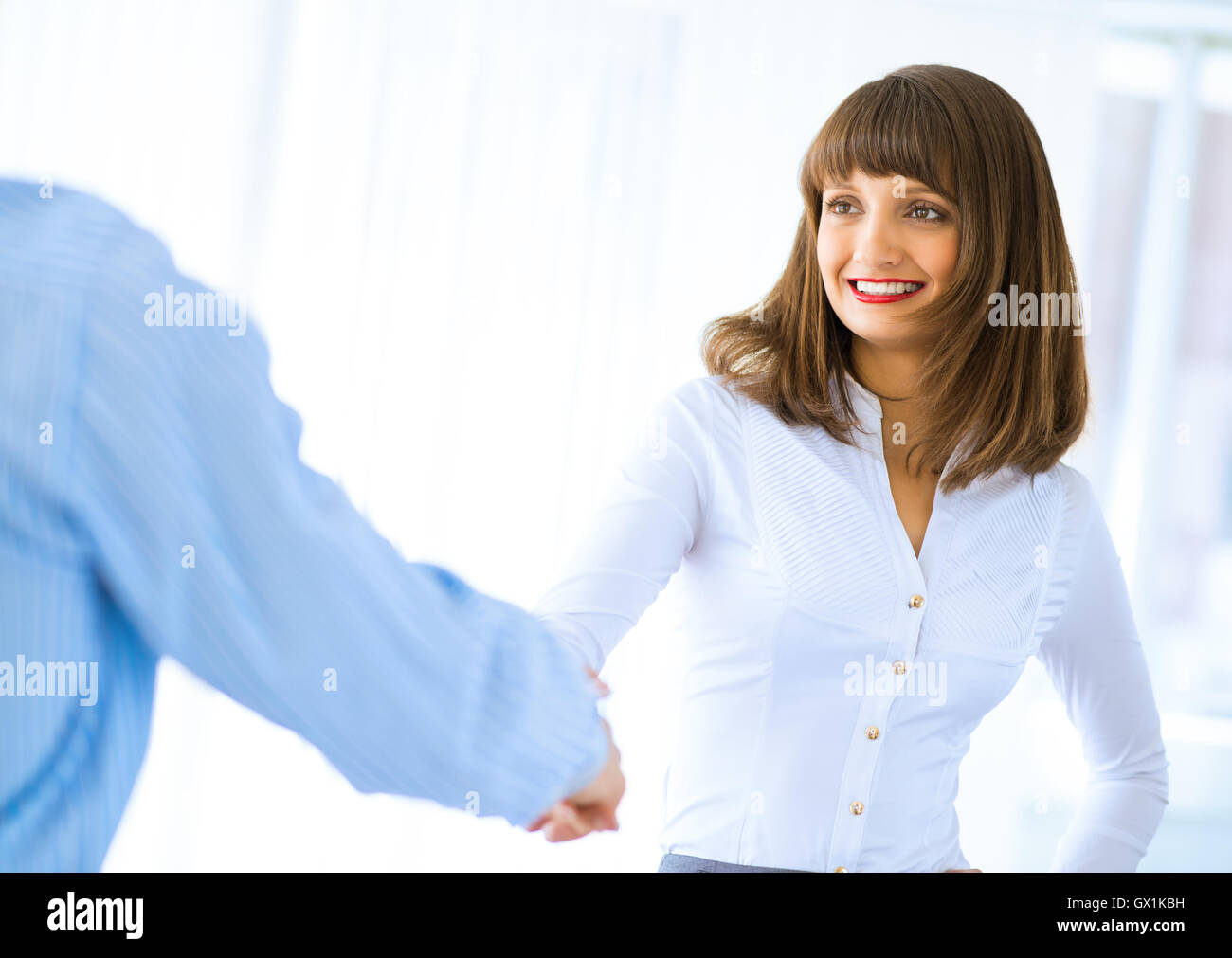 business woman shaking hands with a client Stock Photo - Alamy