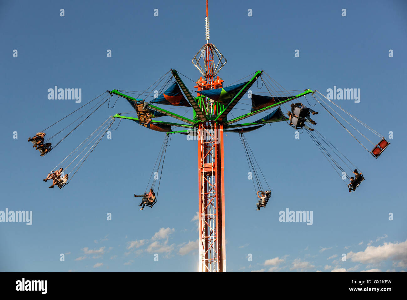 Fair goers ride the Star Flyer swing amusement ride at Cheyenne ...