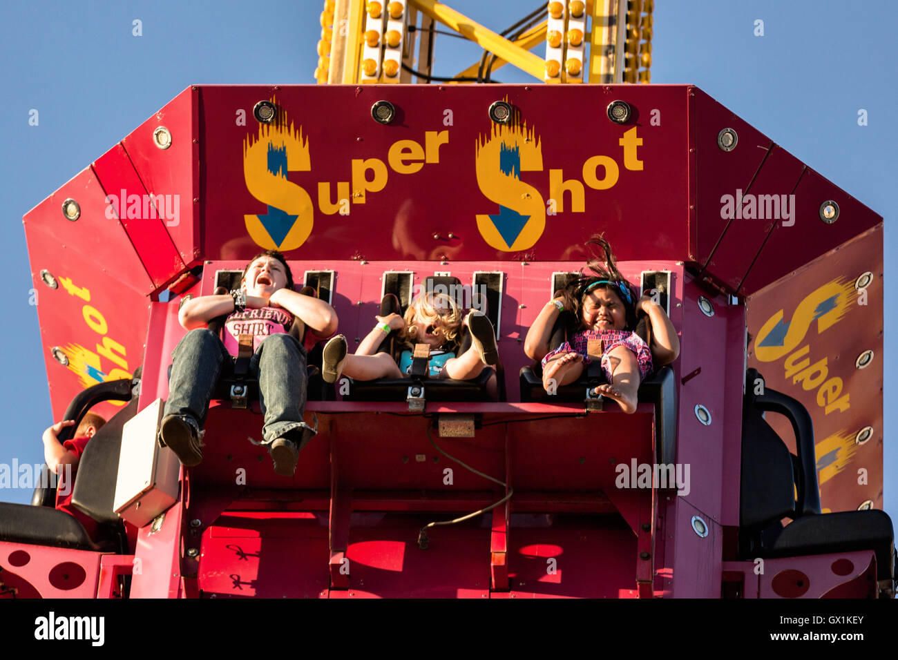 Children react during the Super Shot amusement ride at Cheyenne ...