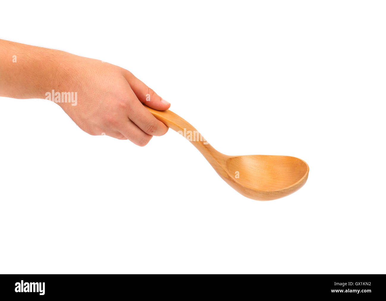 Hand holds wooden spoon Stock Photo - Alamy