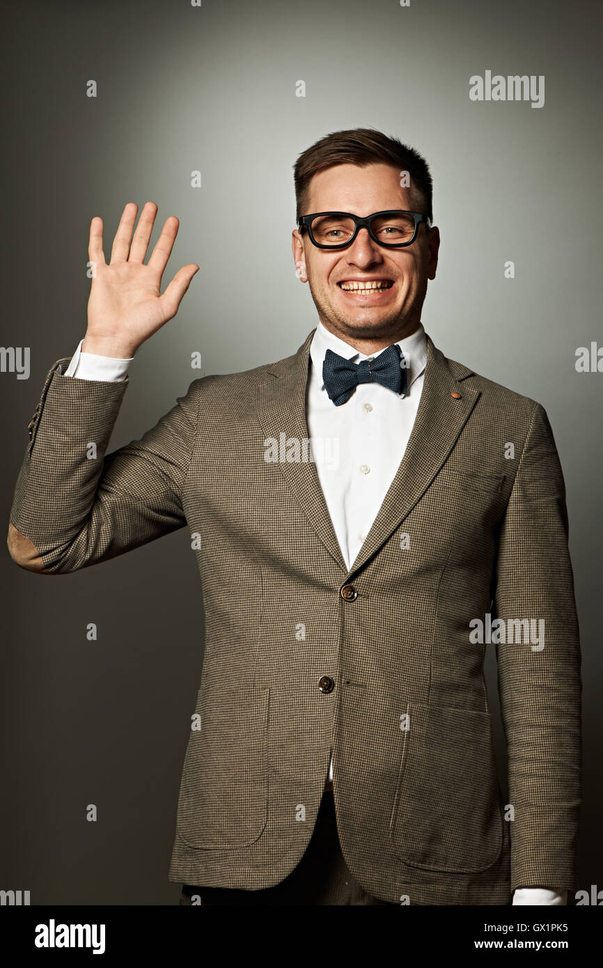Nerd in eyeglasses and bow tie says Hello Stock Photo - Alamy
