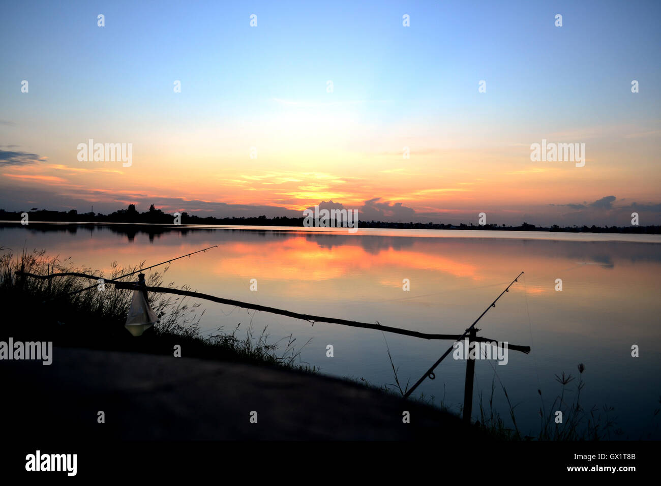 Sunset at the river Stock Photo - Alamy