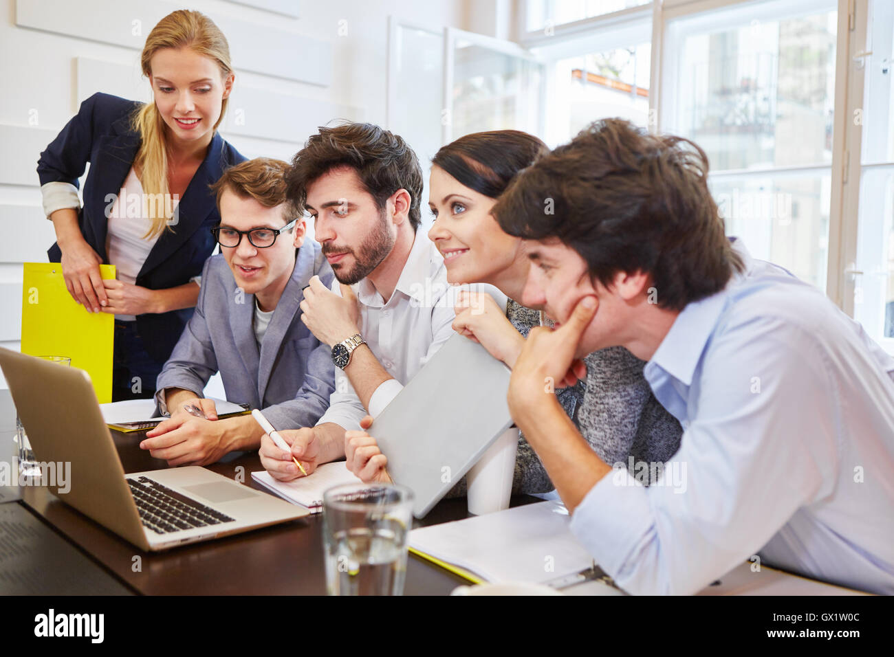 Team with laptop computer at workshop training and learning Stock Photo ...