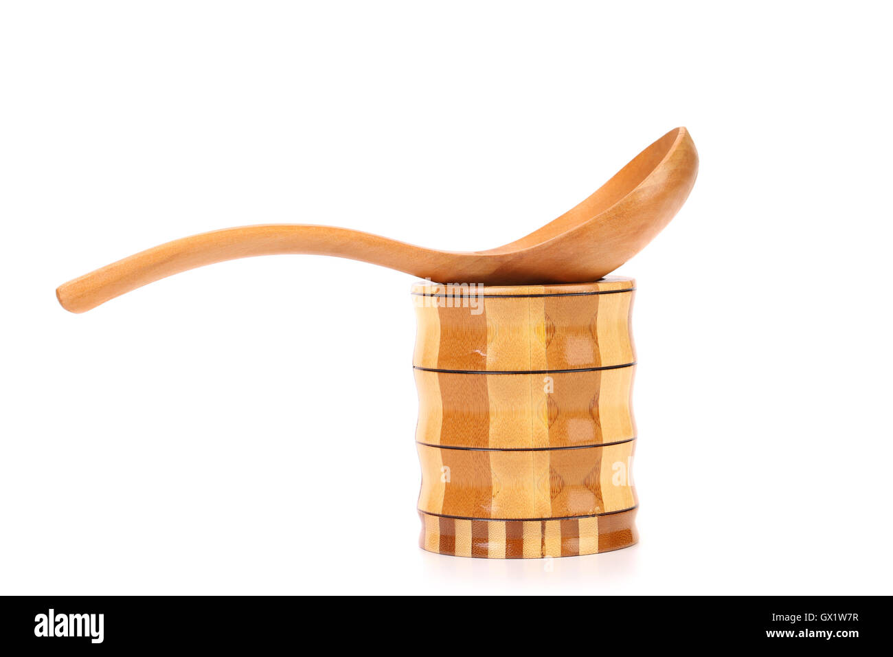 Wooden spoon and jar Stock Photo - Alamy