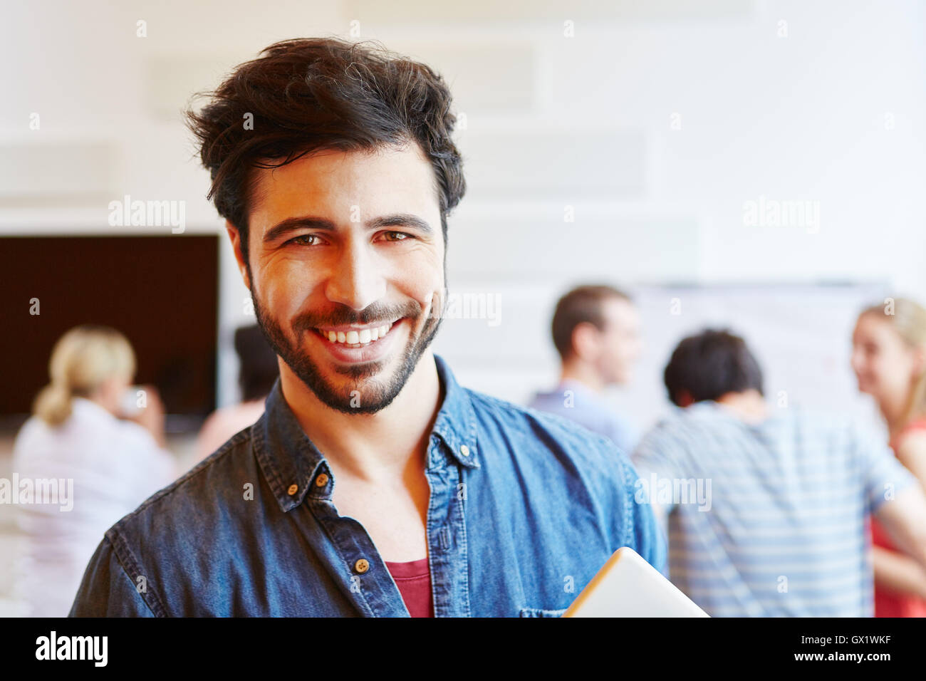 Young student smiling content in a start-up company Stock Photo - Alamy