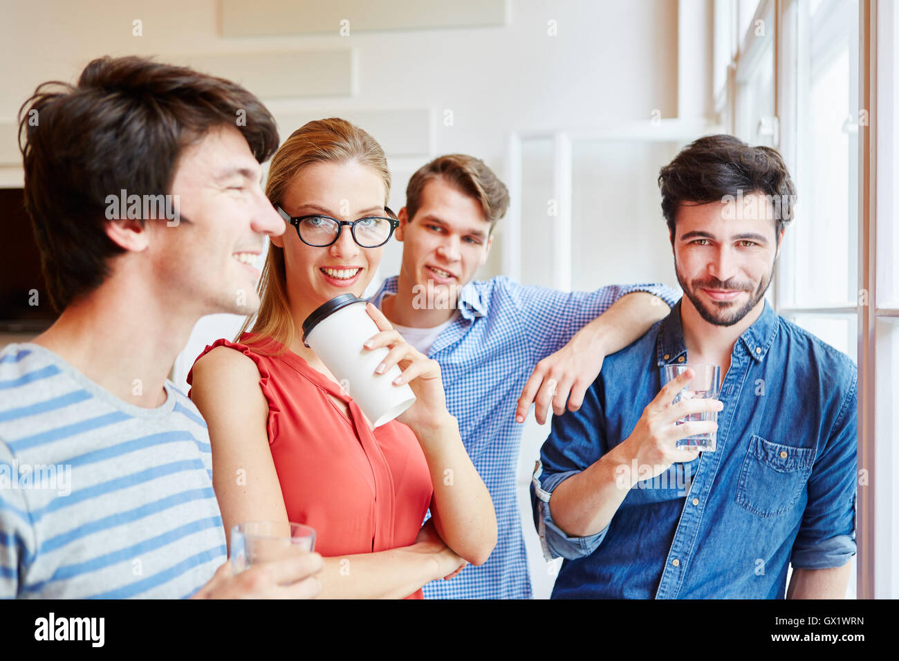 Successful start-up team taking a coffee break Stock Photo - Alamy