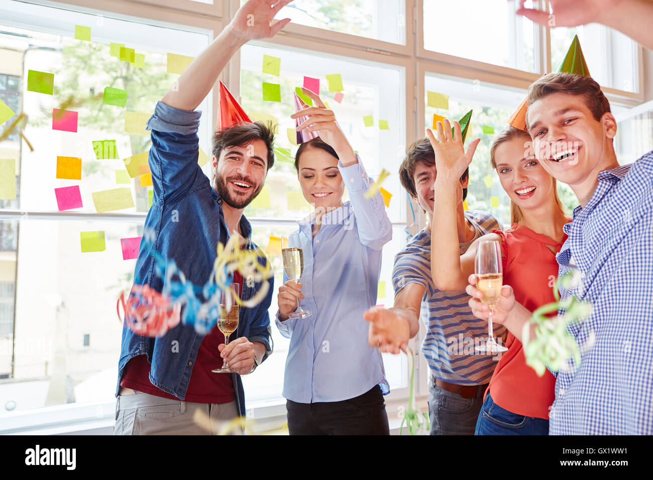 Students having fun celebrating carnival in start-up Stock Photo - Alamy