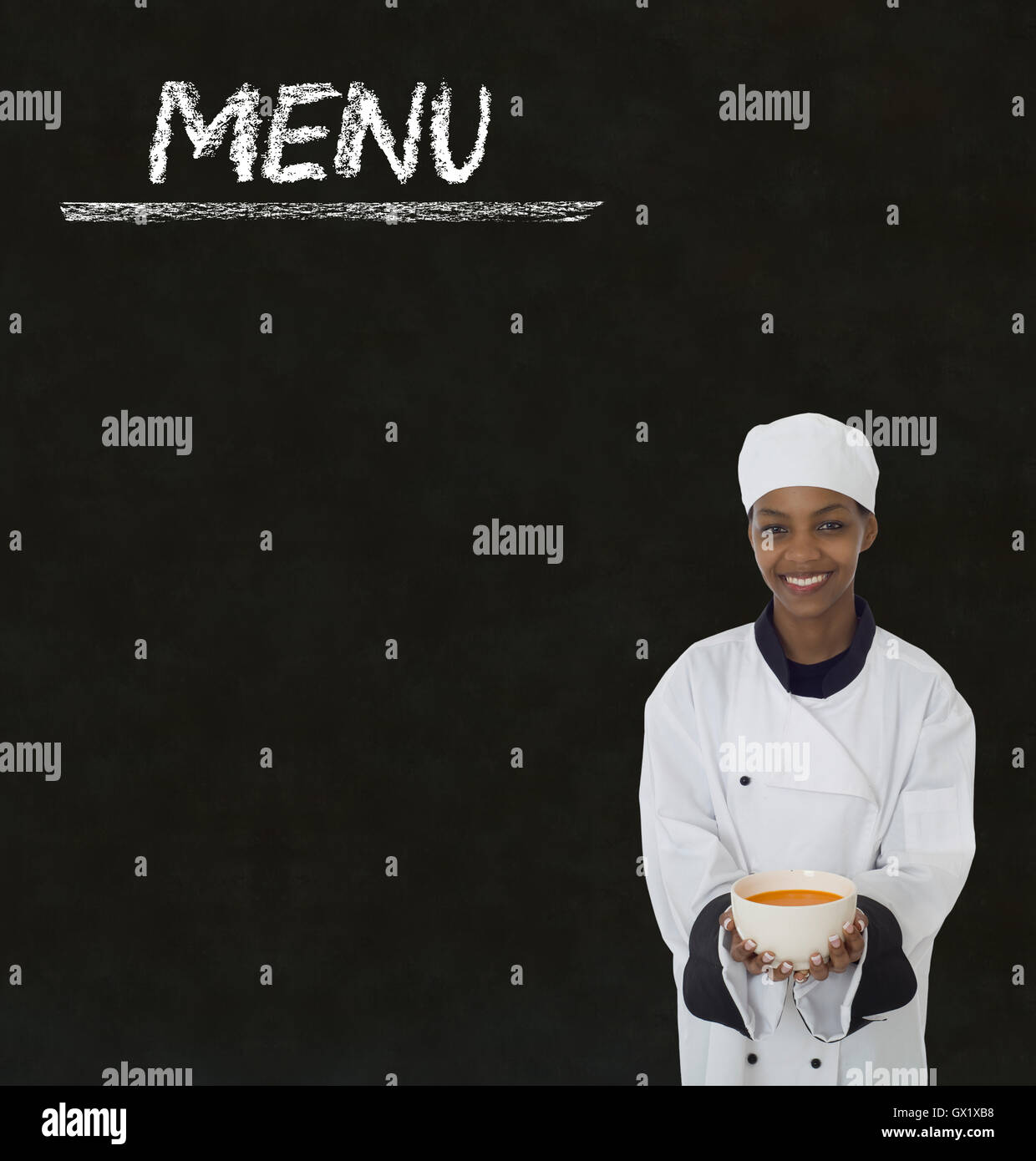 Chef with chalk menu sign on a blackboard background Stock Photo - Alamy