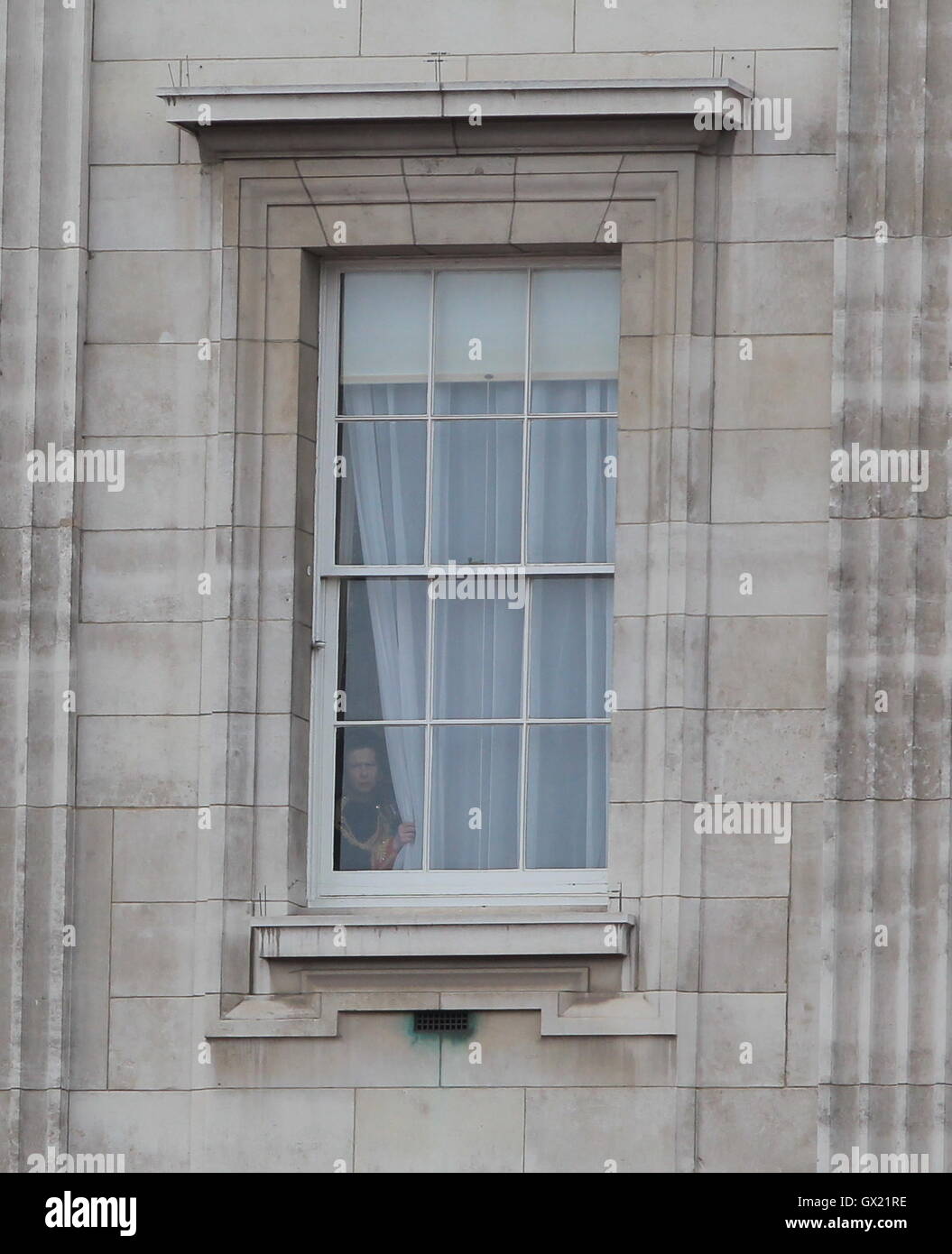 Princess Anne peeks out the window of Buckingham Palace ahead of ...