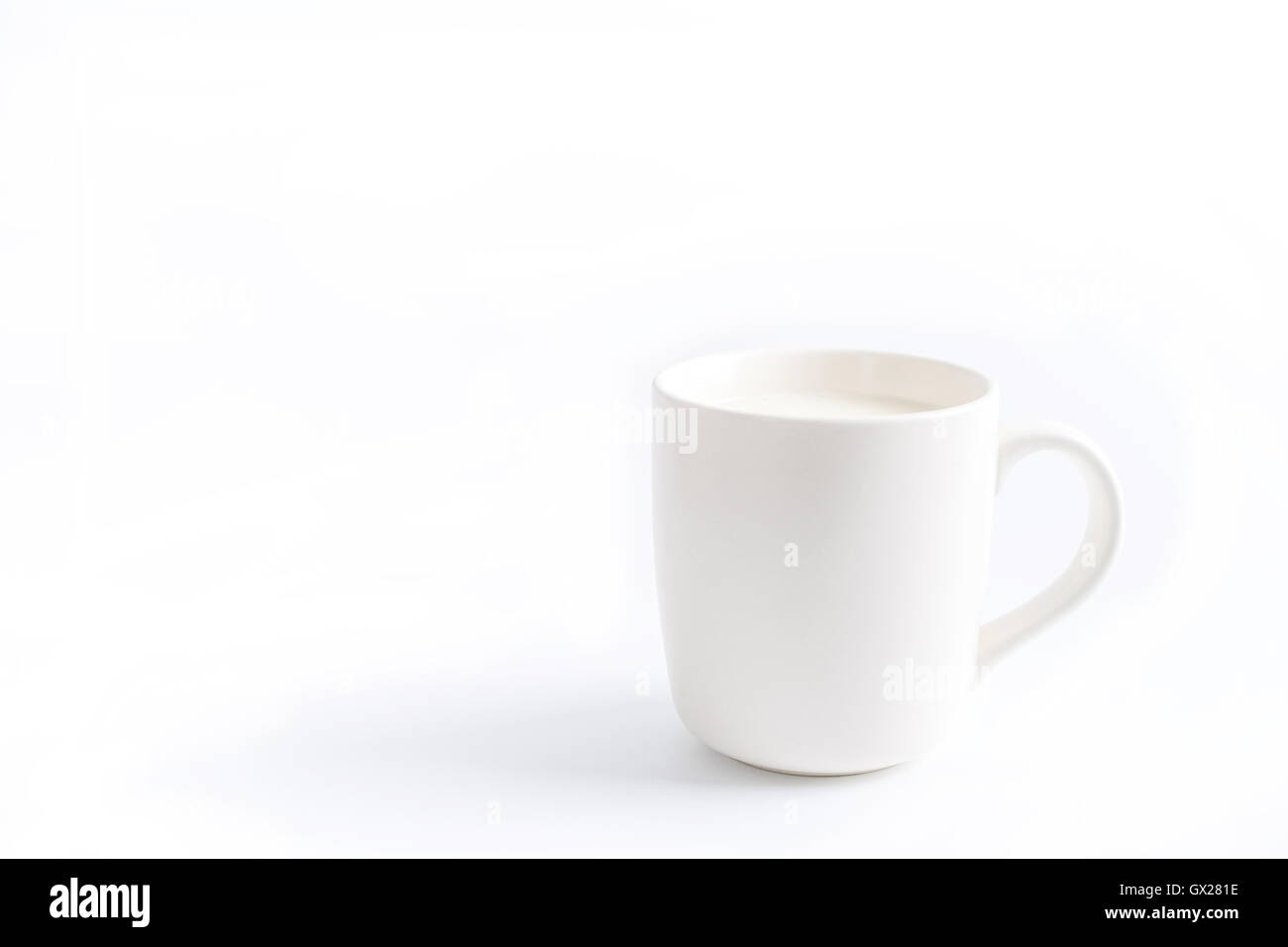 Milk and white cup,Isolated on white background Stock Photo - Alamy