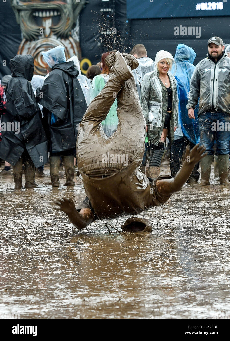 Download Festival revellers in the mud Featuring: Atmosphere Where ...