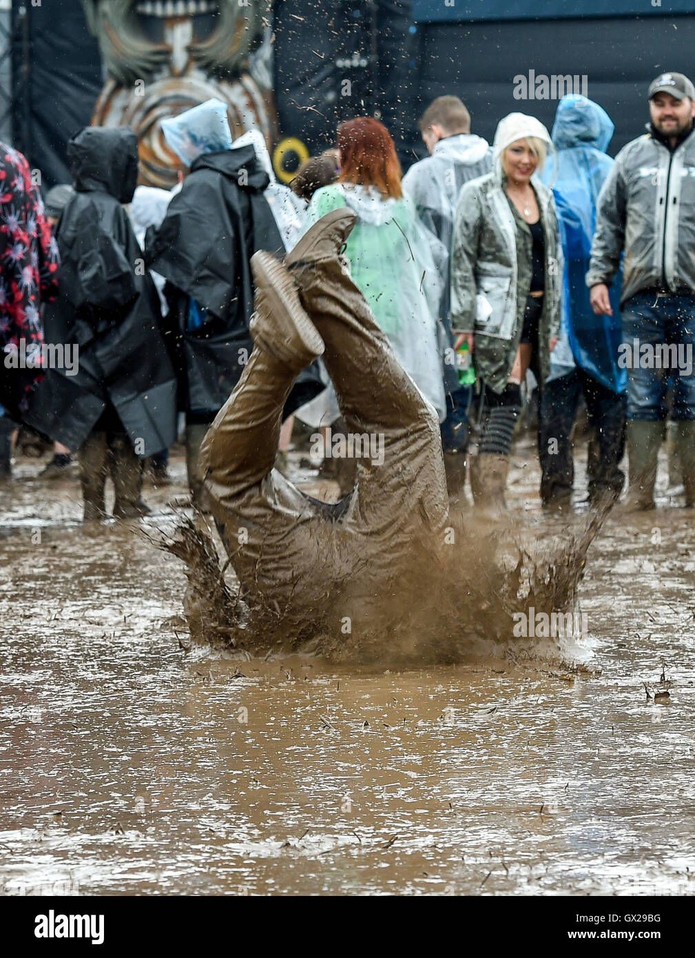 Download Festival revellers in the mud Featuring: Atmosphere Where ...