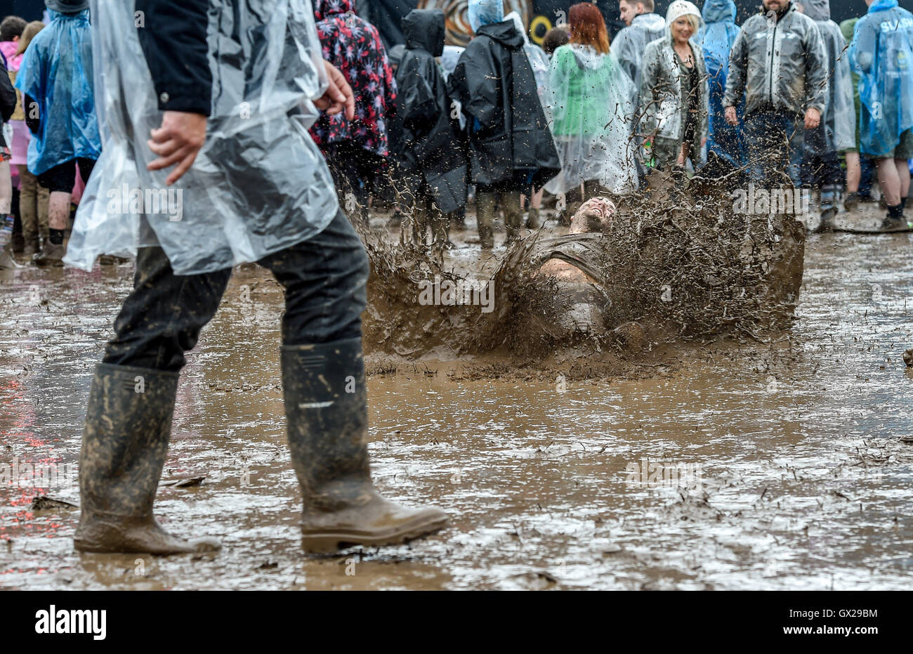 Download Festival revellers in the mud Featuring: Atmosphere Where ...