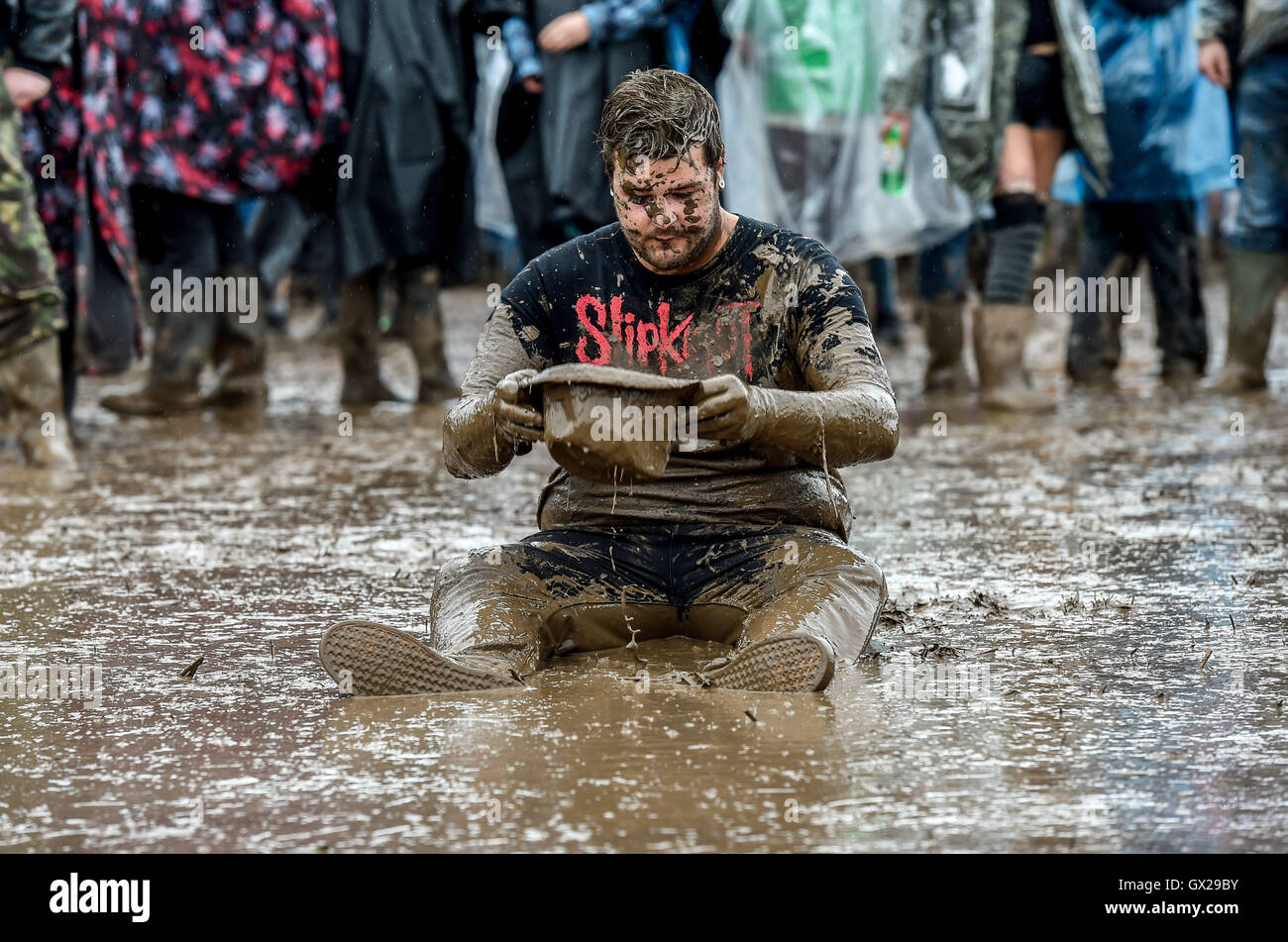 Download Festival revellers in the mud Featuring: Atmosphere Where ...