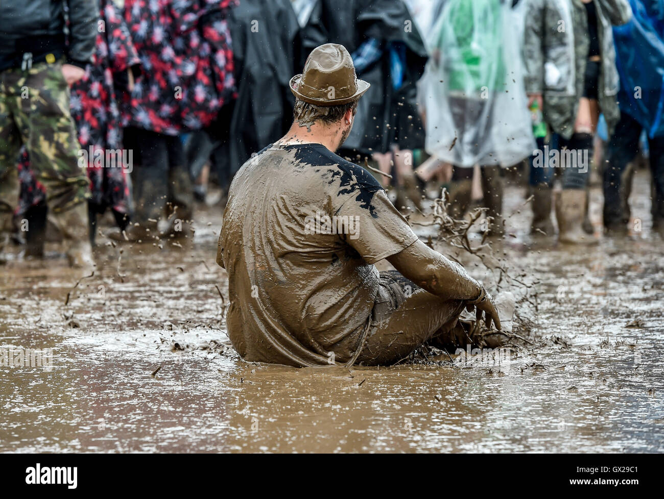 Download Festival revellers in the mud Featuring: Atmosphere Where ...