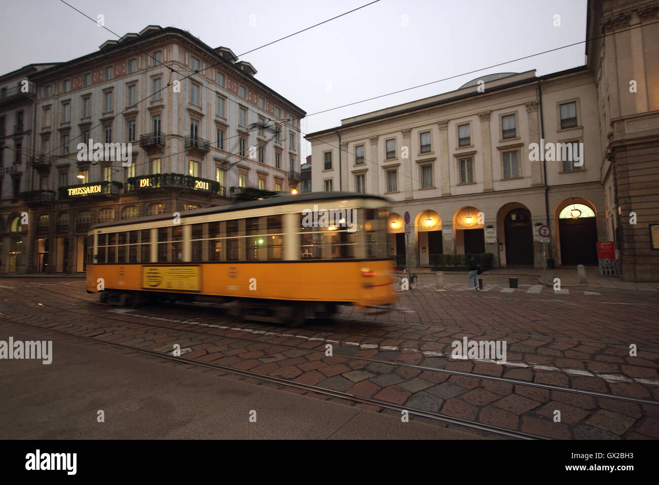a tram passing by near the opera house theater "Teatro alla Scala ...