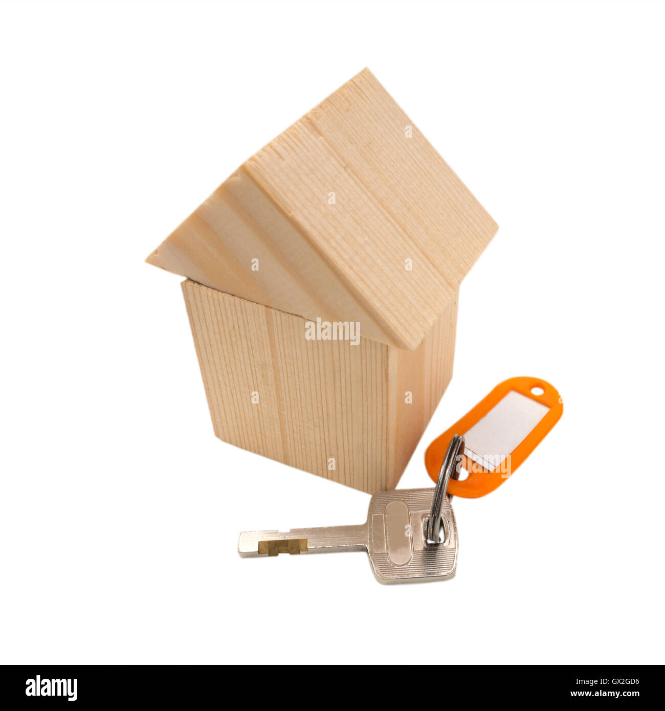 Wooden building blocks home and a key with orange label isolated on ...