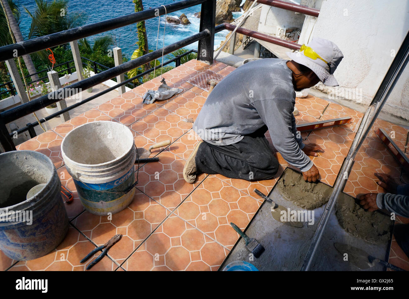 Mexican man laying tile in Acapulco, Mexico Stock Photo - Alamy