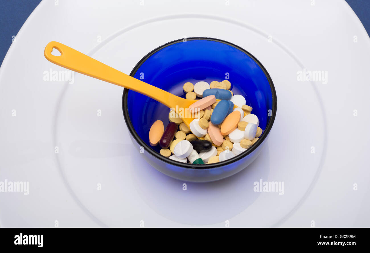 A Bowl full of tablets and capsules placed in plate Stock Photo - Alamy