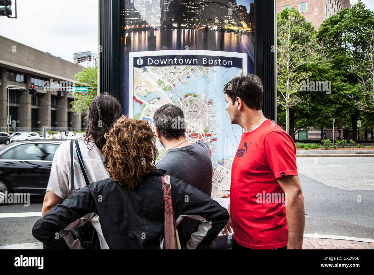 People standing in front of tourist city map, boston Stock Photo - Alamy