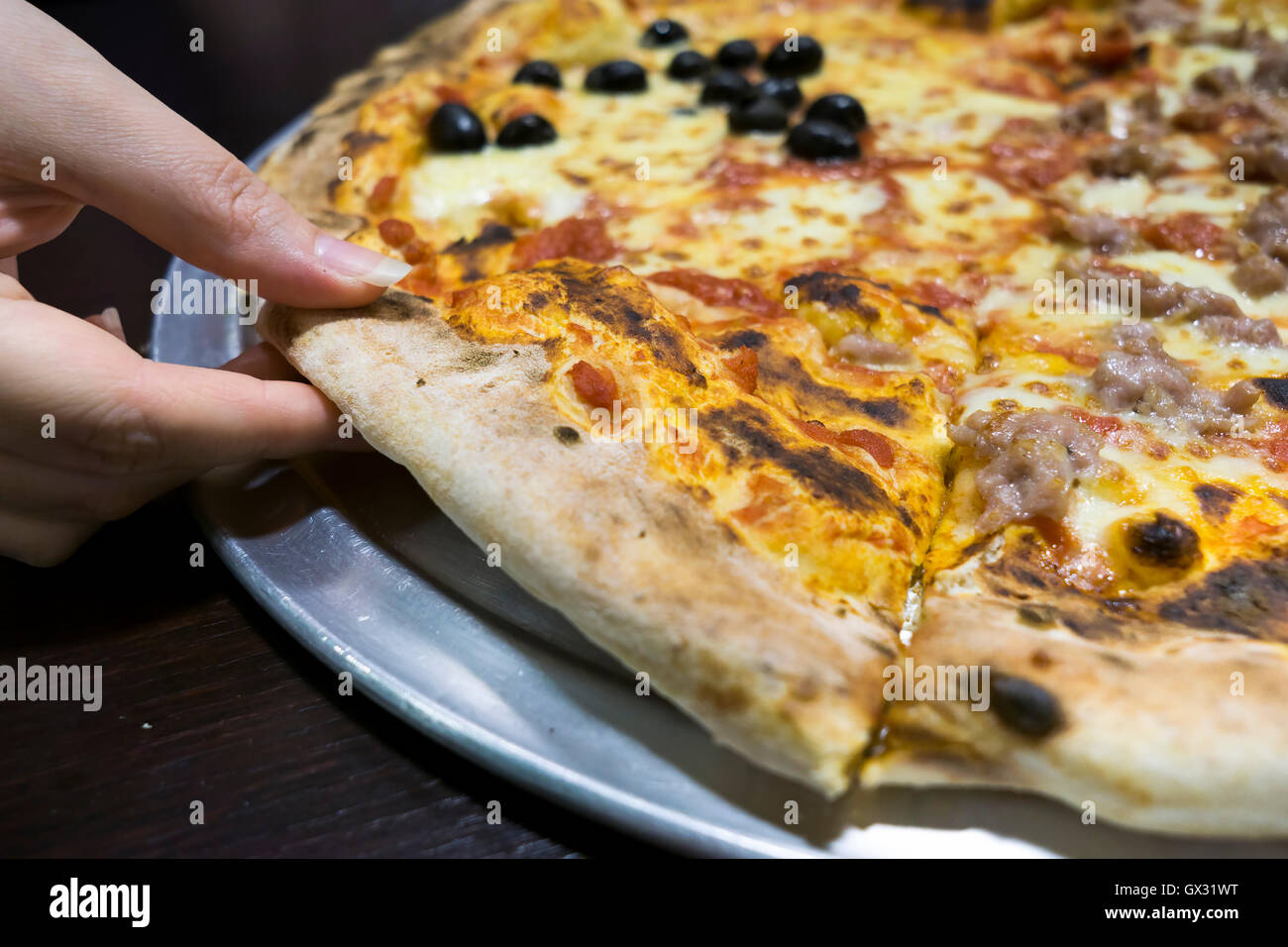 Pizza topping hand hi-res stock photography and images - Alamy