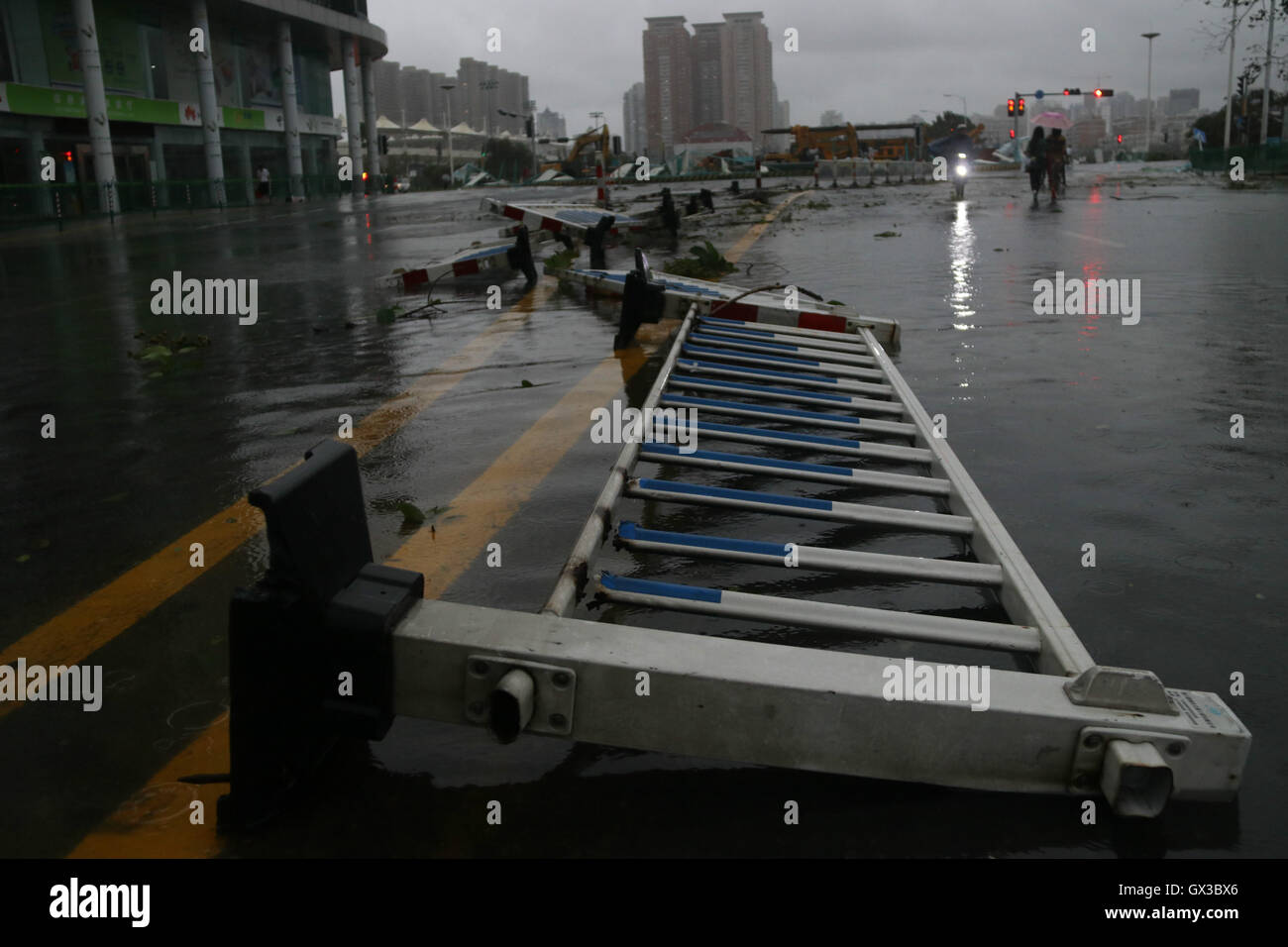 Xiamen, China's Fujian Province. 15th Sep, 2016. A guardrail is blown ...