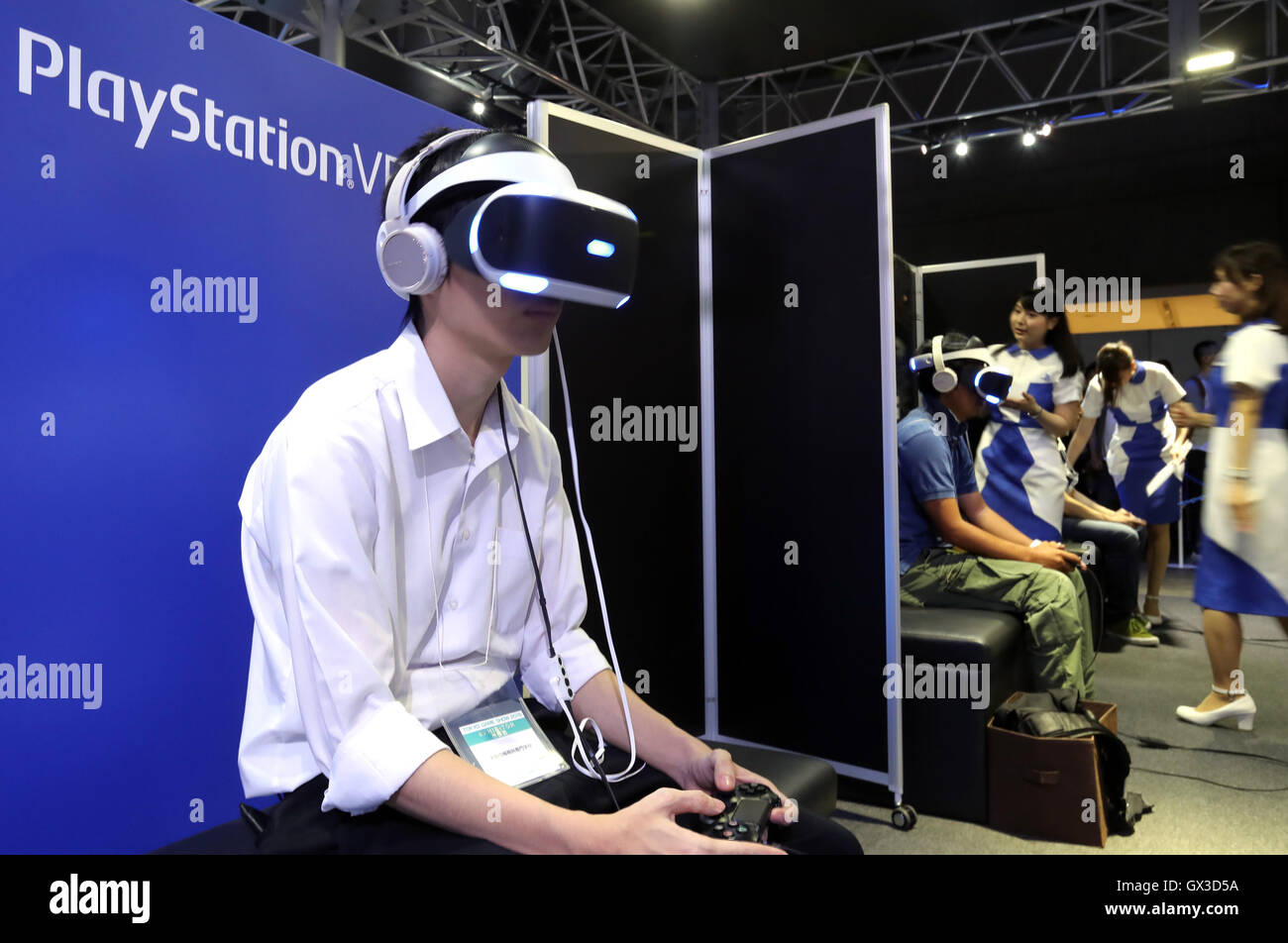 Thursday. 15th Sep, 2016. Visitors try to play virtual videogames with ...