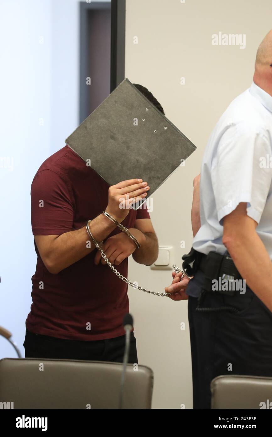 Gera, Germany. 15th Sep, 2016. The main defendant hides his face behind ...
