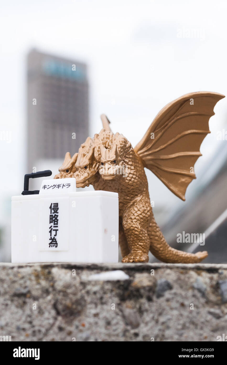 Film character King Ghidorah bows in deep apology during a press ...