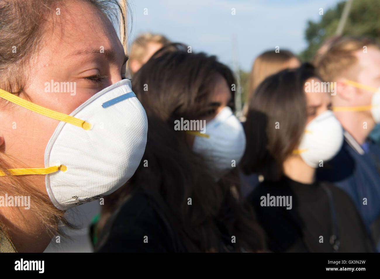 Berlin, Germany. 16th Sep, 2016. Demonstrators wear respirator masks ...
