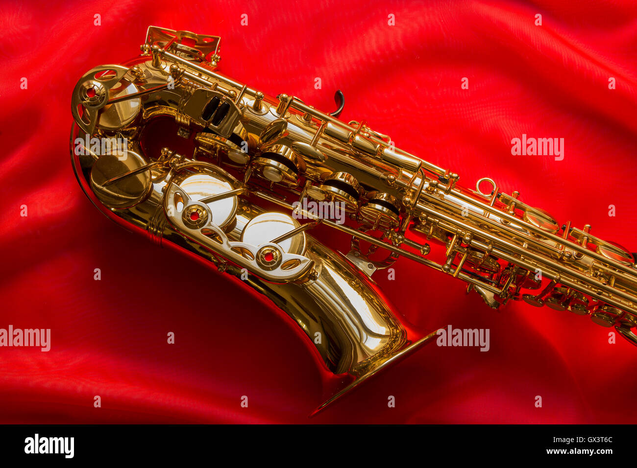 Saxophone on red silk hi-res stock photography and images - Alamy