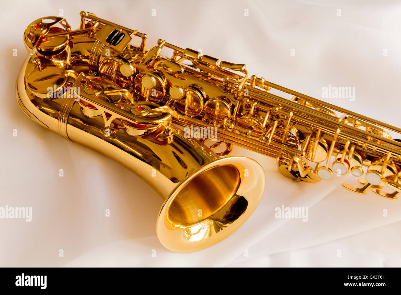 saxophone on delicate White silk Stock Photo - Alamy