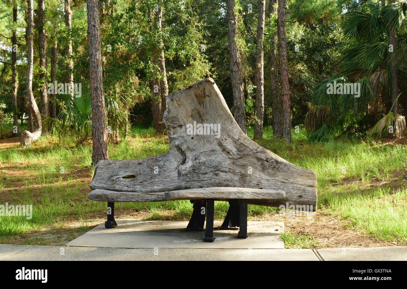 Unique park bench along a walk in a park Stock Photo - Alamy