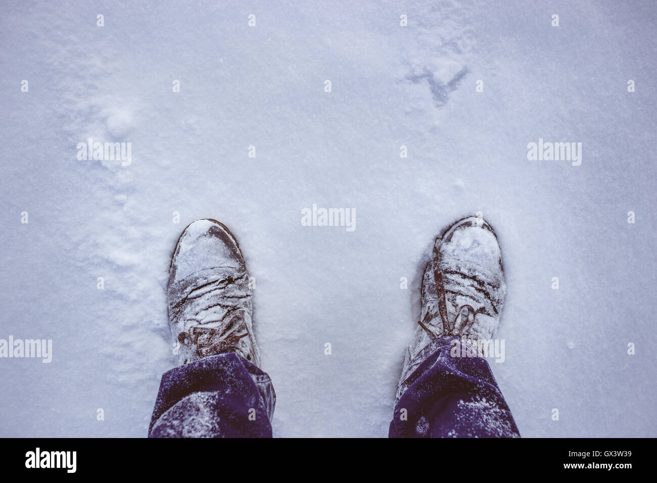 Boots in the deep snow Stock Photo - Alamy