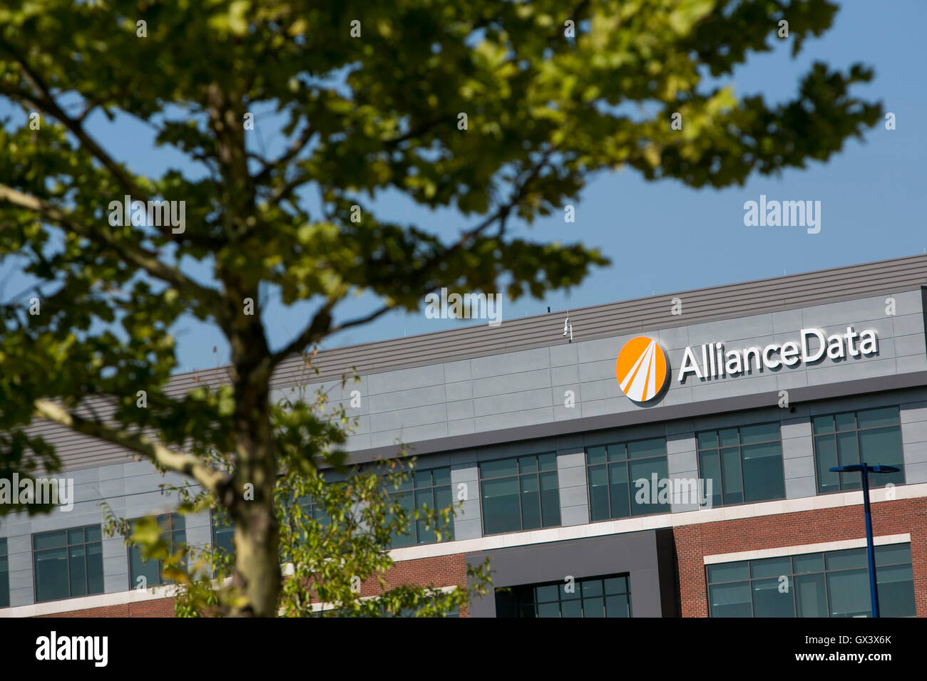 A logo sign outside of a facility occupied by the Alliance Data Systems ...