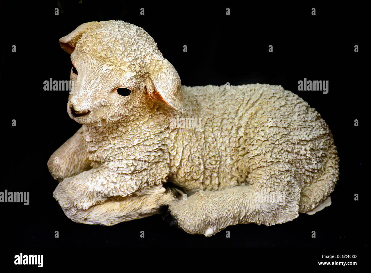 Isolated Kneeling sheep Statue Stock Photo - Alamy