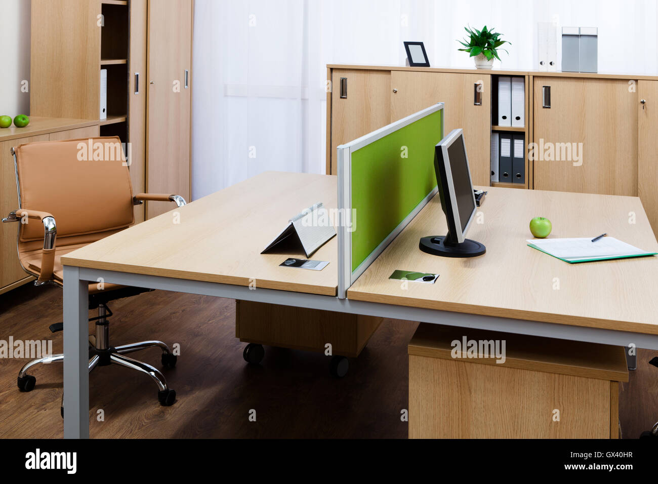 monitor on a desk in a modern office Stock Photo - Alamy
