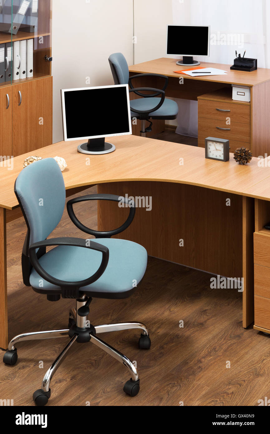 monitor on a desks in a modern office Stock Photo - Alamy