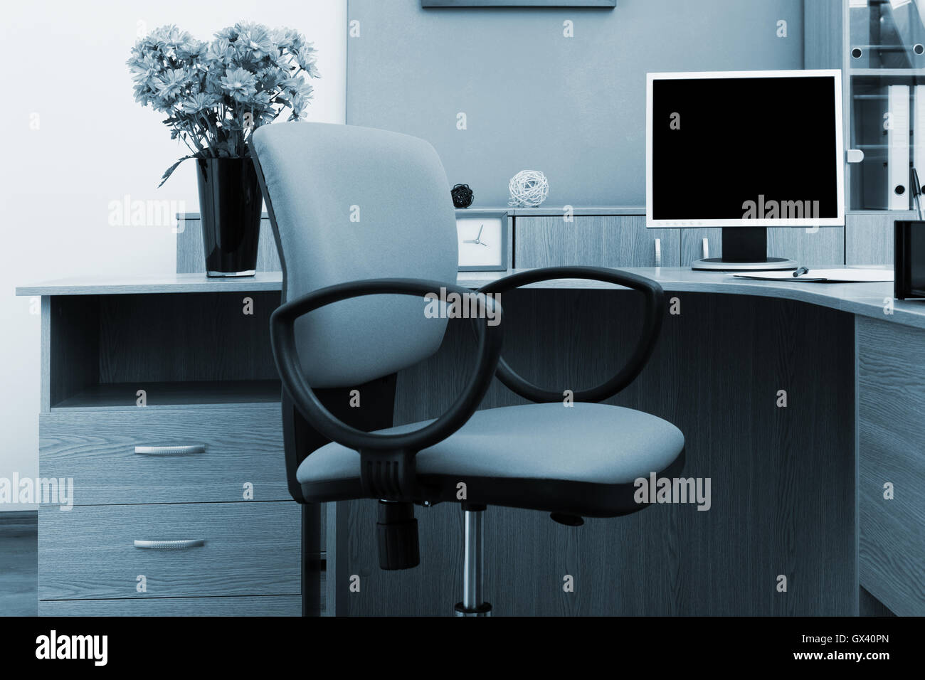 The monitor on a desk at modern office Stock Photo - Alamy