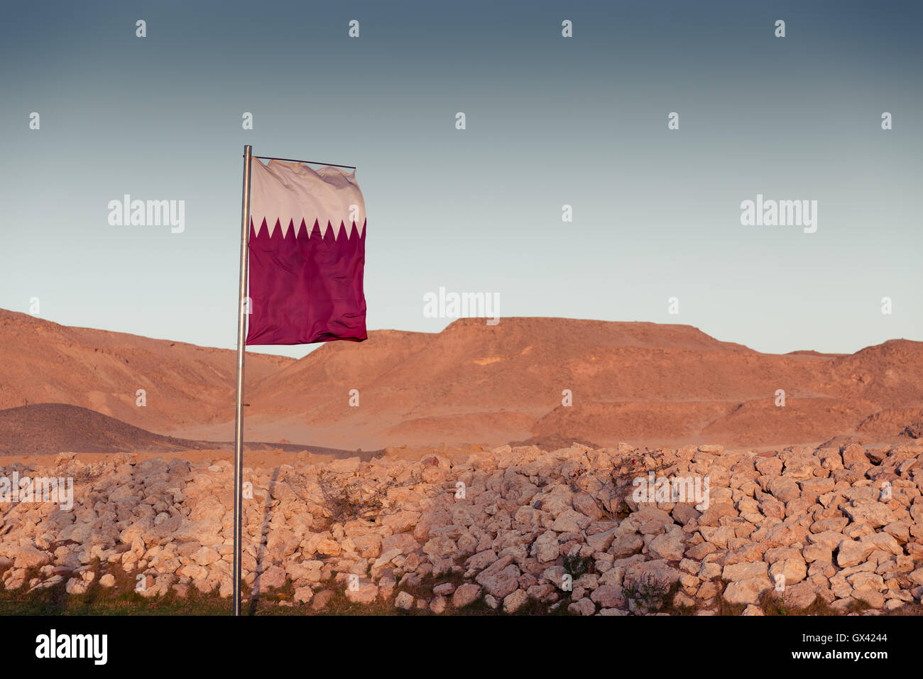 National flag of Qatar on flagpole Stock Photo - Alamy