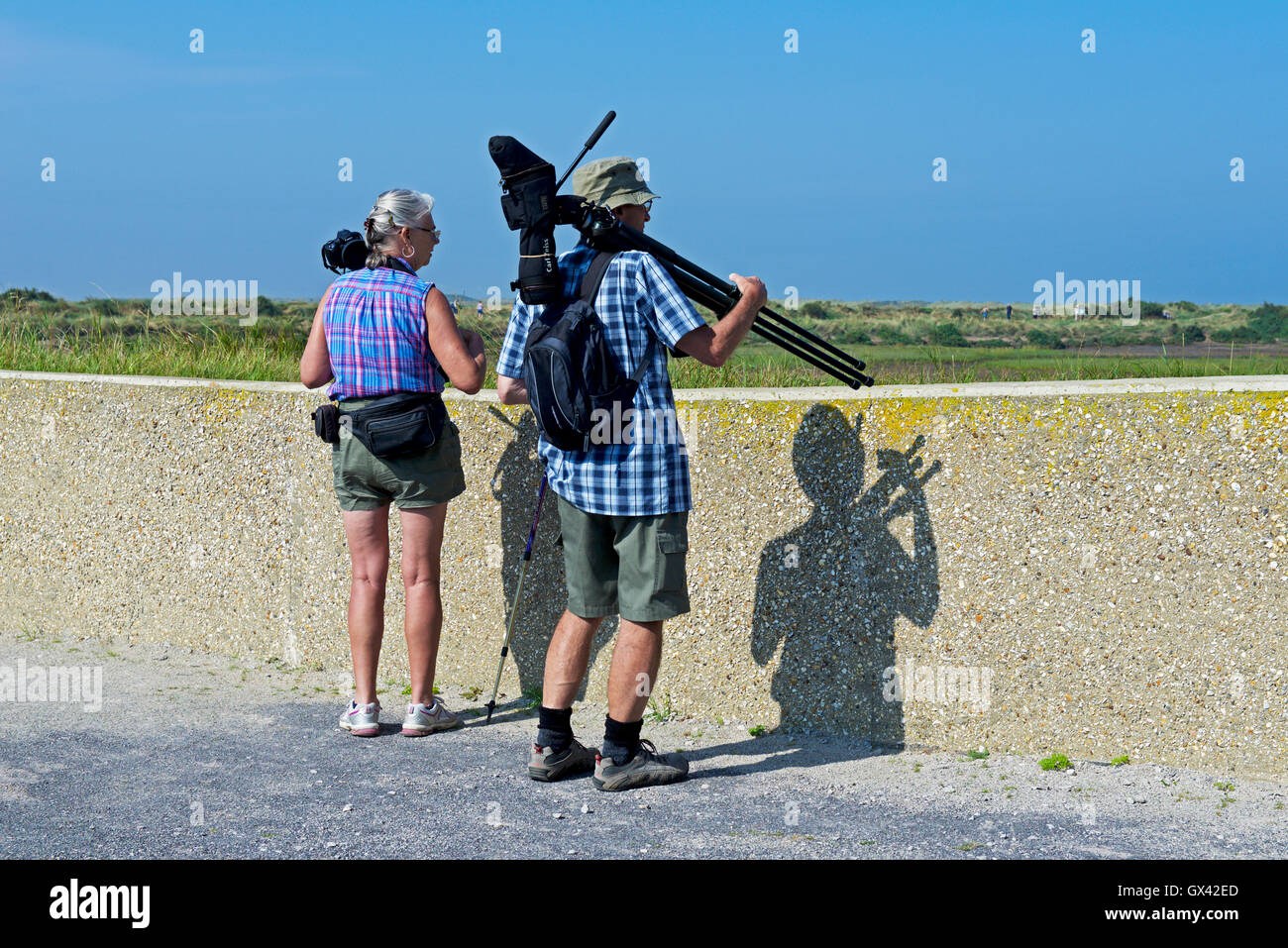 Bird-watchers at RSPB Titchwell nature reserve, North Norfolk, England ...