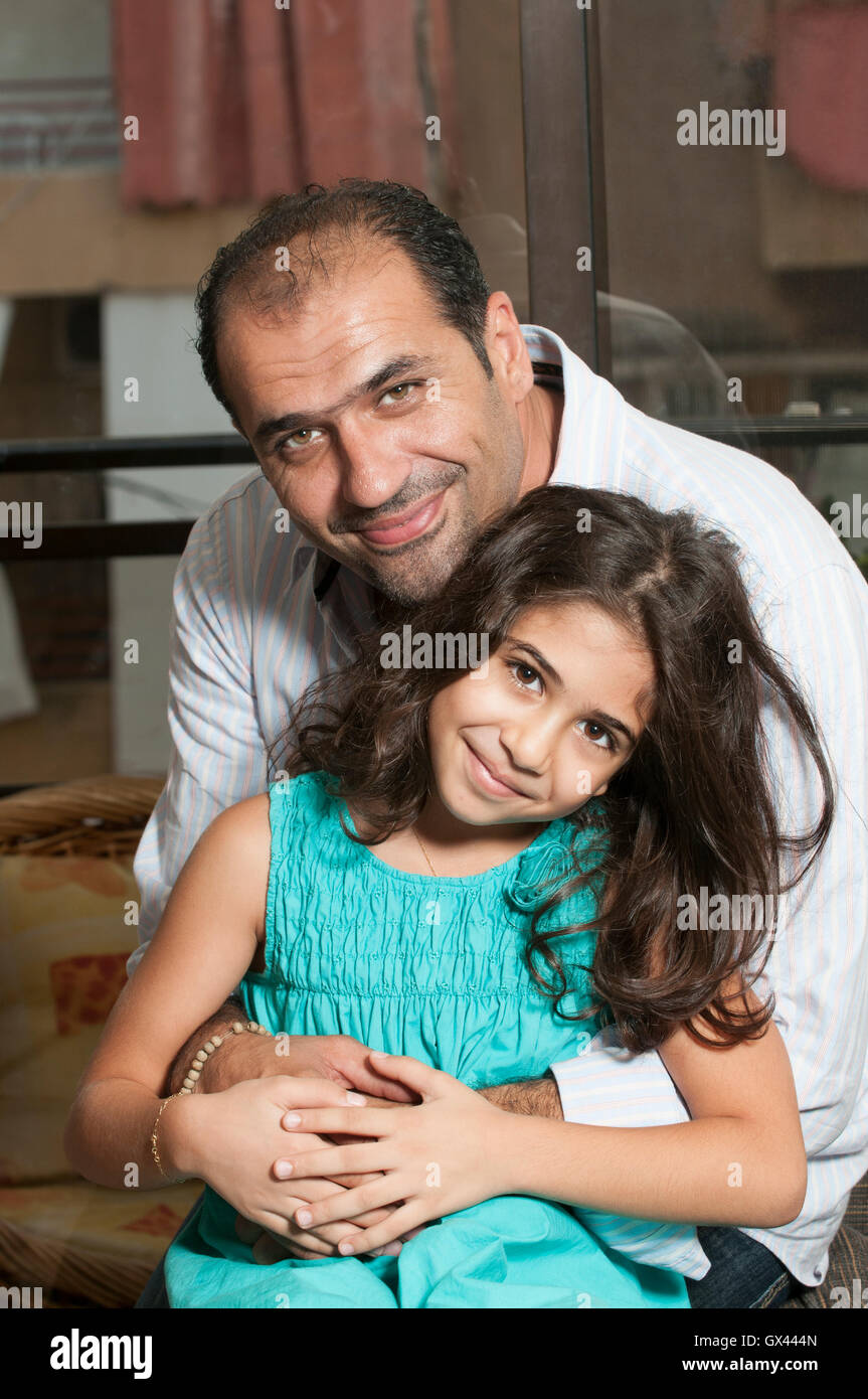 Happy father hugging daughter Stock Photo - Alamy