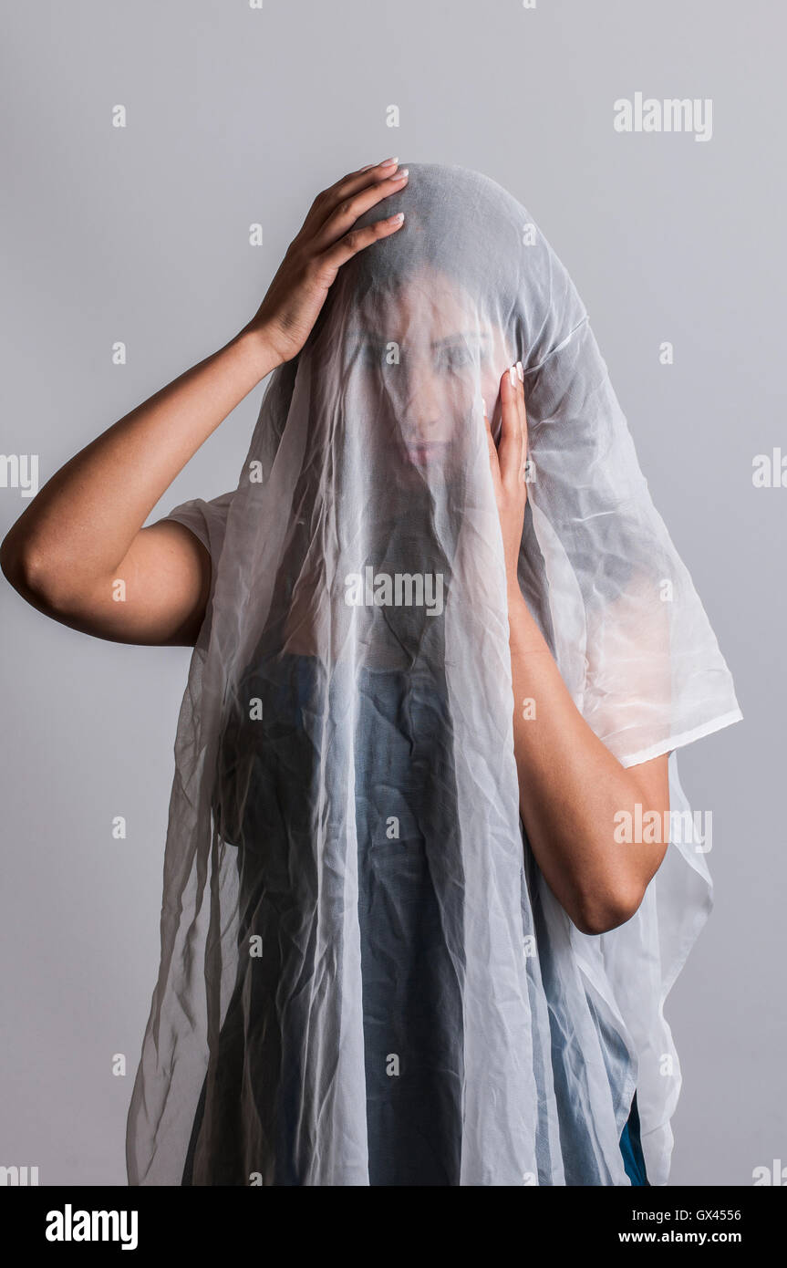 Woman covered with white chiffon fabric hands on head Stock Photo - Alamy