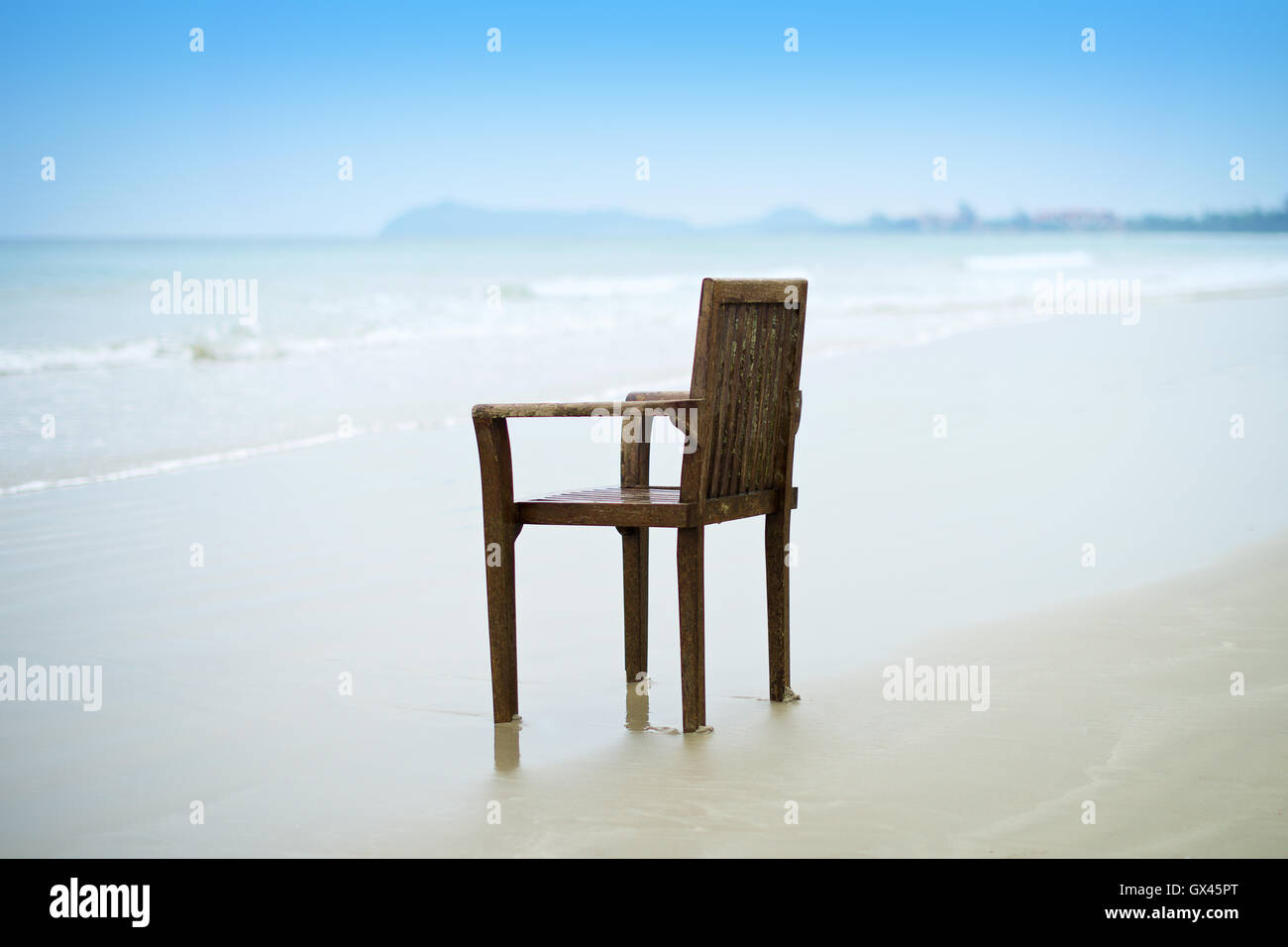 Wooden Chair on the beach Stock Photo - Alamy