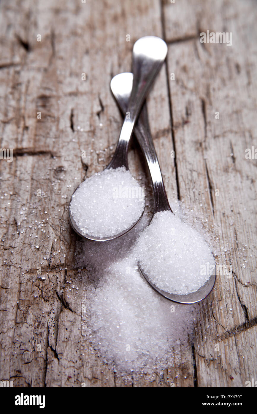 sugar in two spoons Stock Photo - Alamy