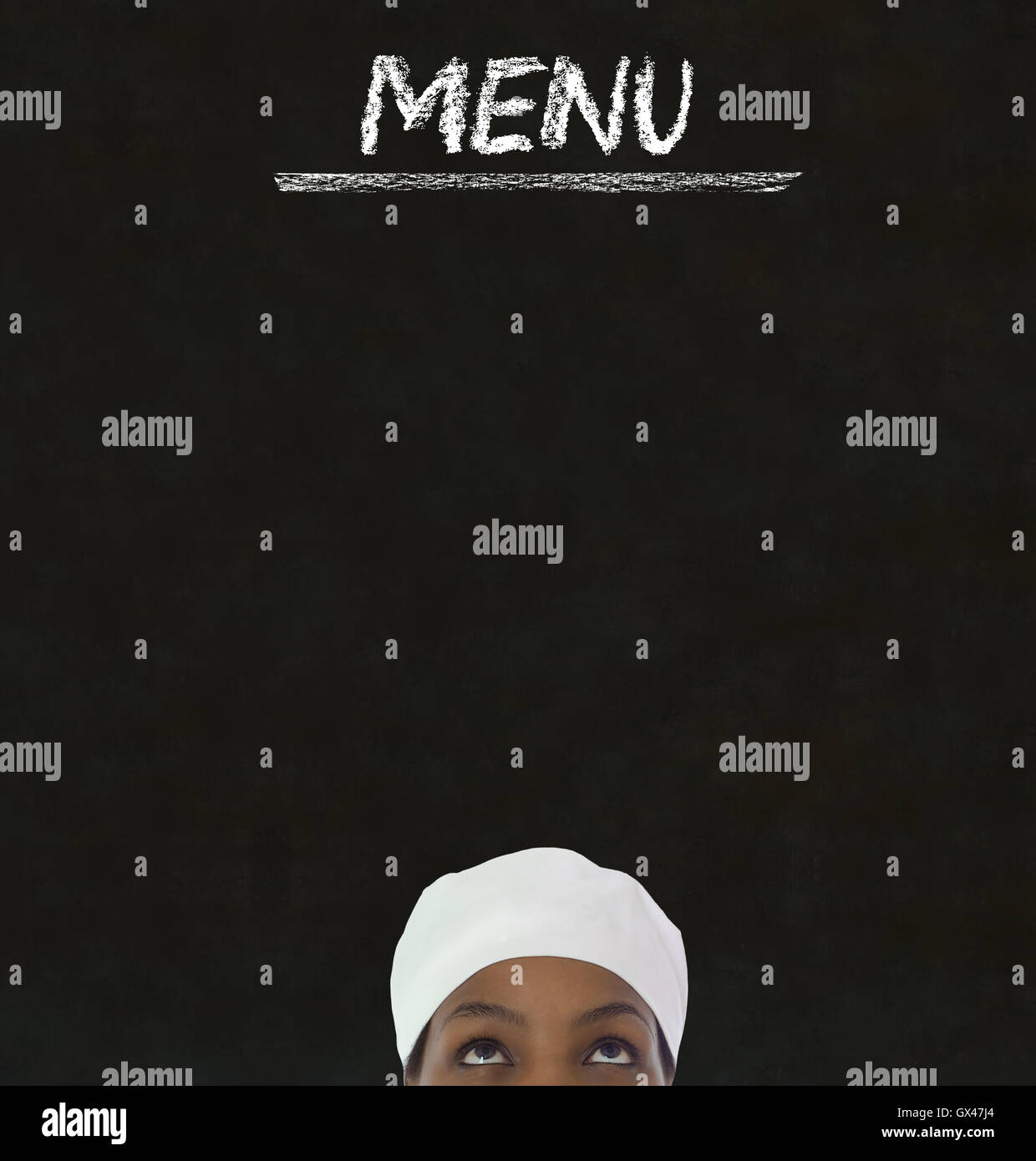 Chef with chalk menu sign on a blackboard background Stock Photo - Alamy