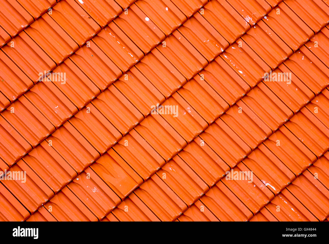 Modern red roof tile pattern diagonally set Stock Photo - Alamy