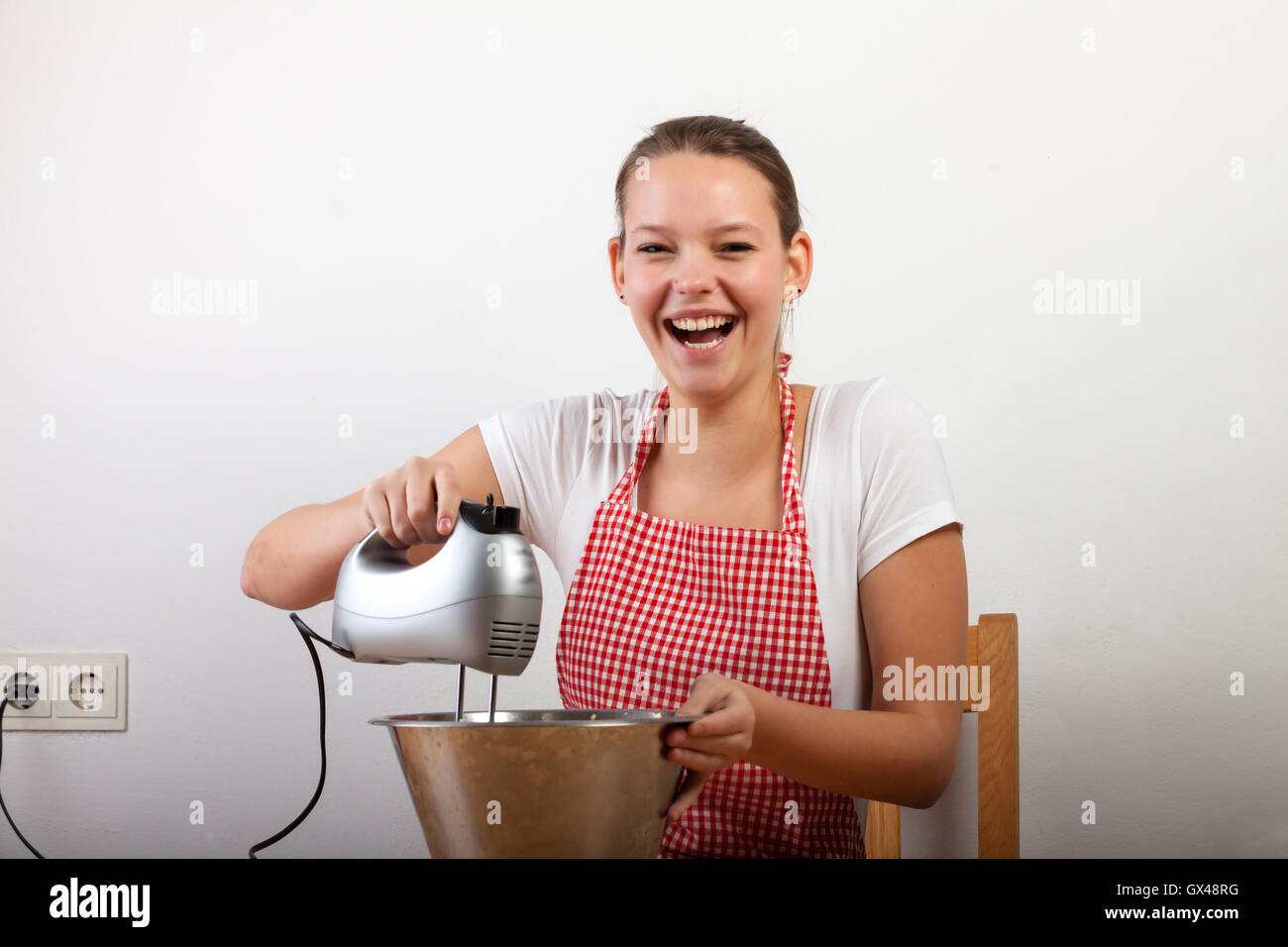 young woman baking a cake Stock Photo - Alamy